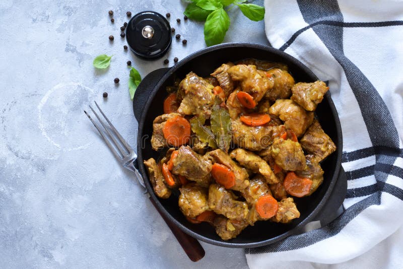 Stew with Spices in a Pan on a Concrete Background. View from Above ...