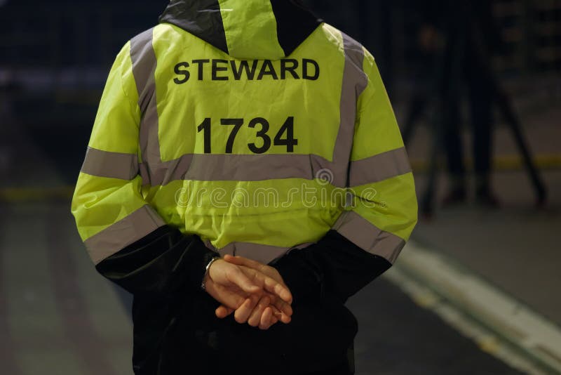 Steward works at an event stock image. Image of supporters - 143678845