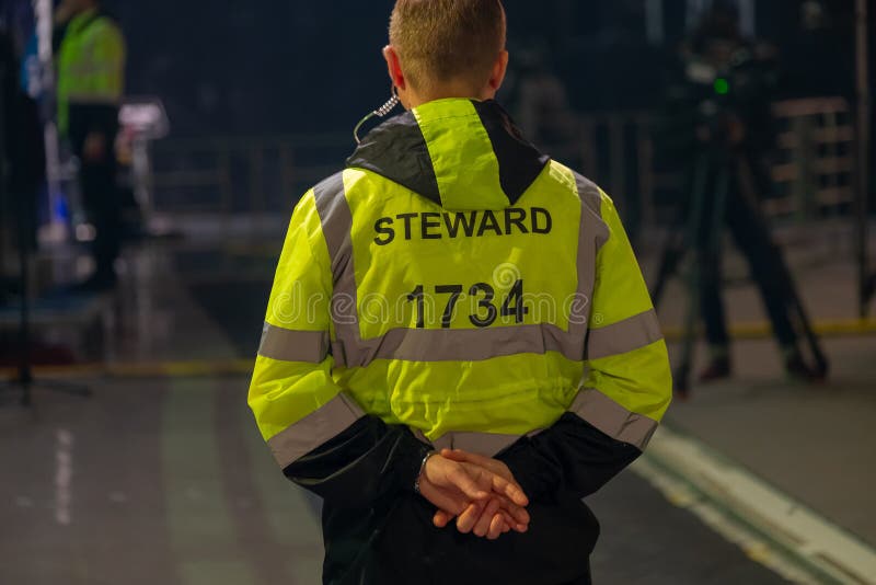 Steward works at an event editorial stock photo. Image of stewards ...
