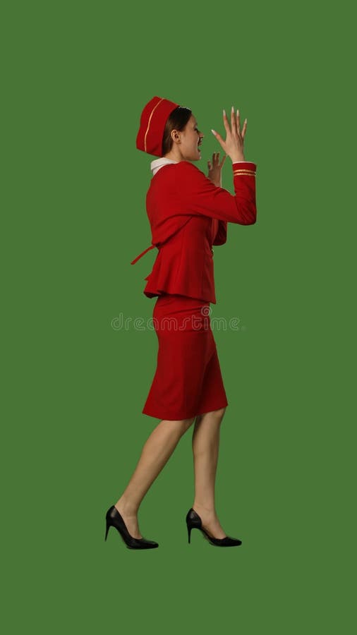 Stewardess in Red Uniform Clapping Hands with Green Backdrop Stock ...