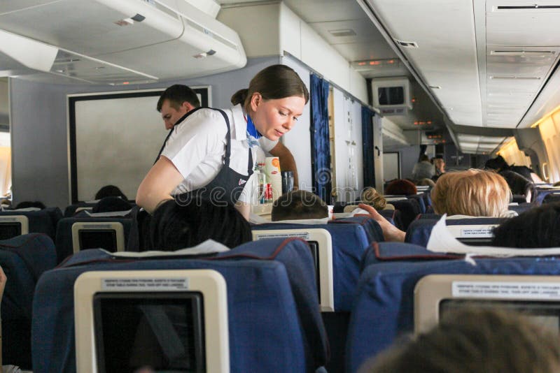 Stewardess at work. editorial image. Image of comfort - 100421845