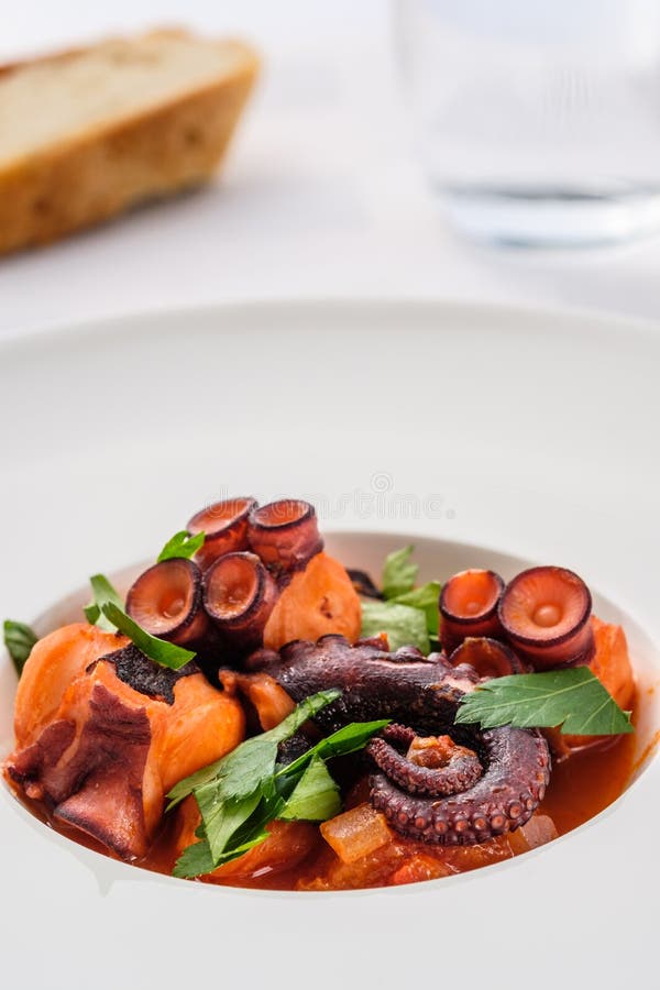 Stewed Octopus Squid with Tomatoe Sauce in a Plate Stock Photo - Image ...