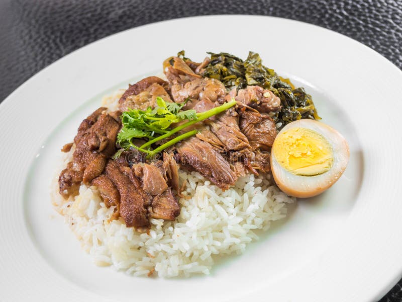 Stewed Pork Leg on Rice with Boiled Egg and Preserve Stock Photo ...