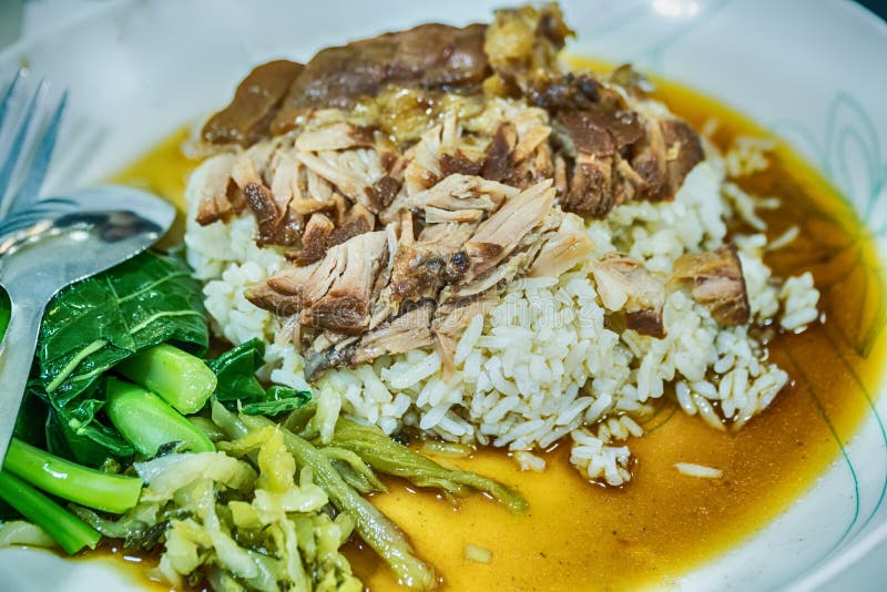 Stewed Pork Leg on Rice with Garlic and Kale in Top View Stock Photo ...