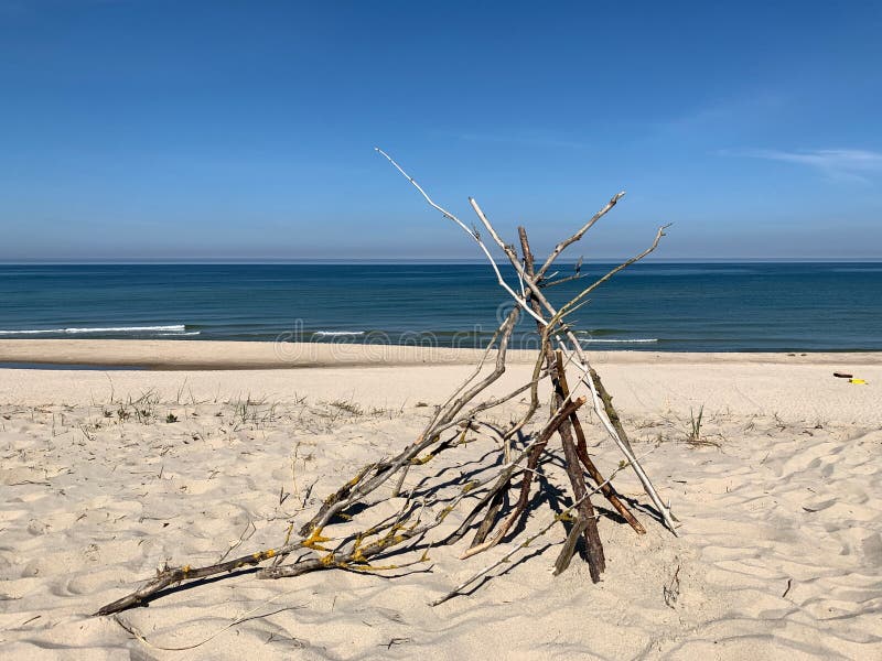 Stick Construction on Beach Sand, Land Art on the Sea Coast Stock Photo ...