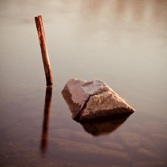 Stick and stone stock photo. Image of stone, pole, square - 22042662