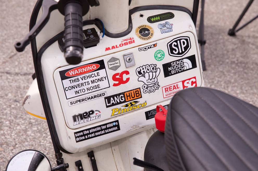 Sticker-covered Moped Dashboard with Humorous Designs and Warnings ...