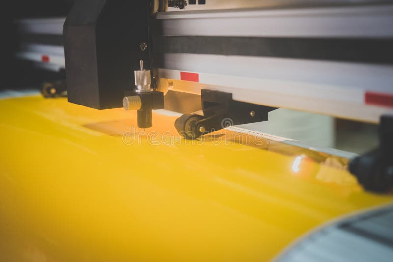 Sticker Machine is Working. Cut Down the Yellow Sticker Stock Image ...