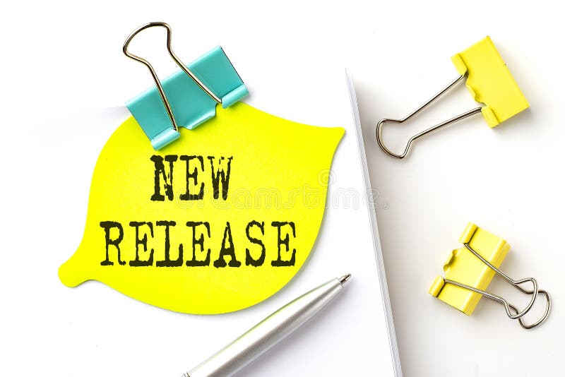 Sticker with NEW RELEASE Text on Notebooks on the White Background ...