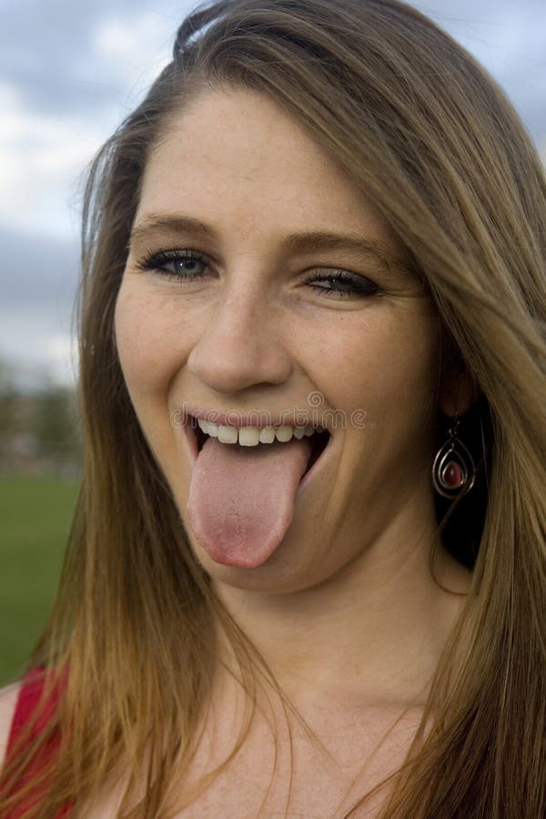 Blond sticking out tongue stock photo. Image of pretty - 3357356