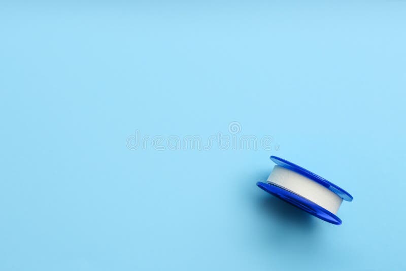 Sticking Plaster Roll on Light Blue Background. Space for Text Stock ...