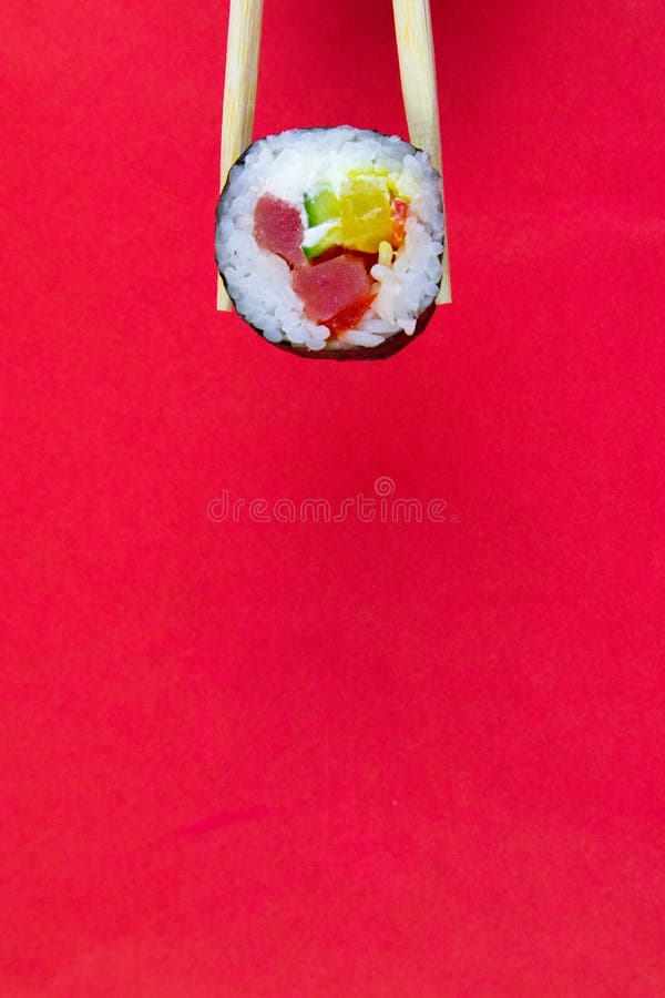 Sticks Hold One Roll Over the Red Board Stock Photo - Image of snack ...