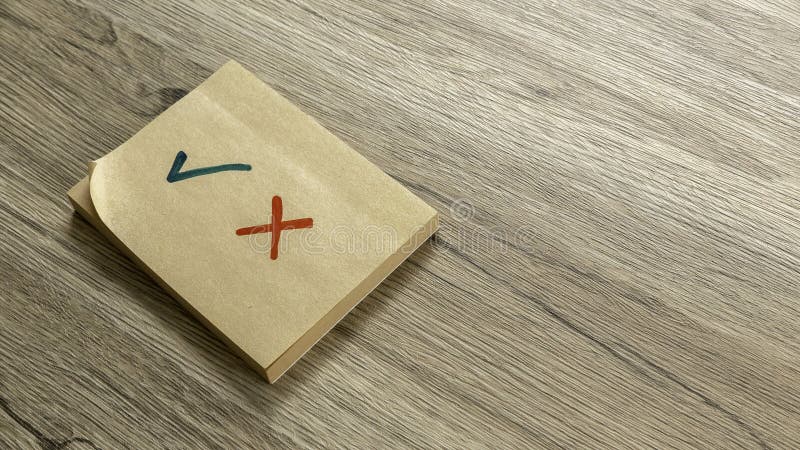 Sticky Note with Check Mark and Cross on Wooden Surface Stock Image ...