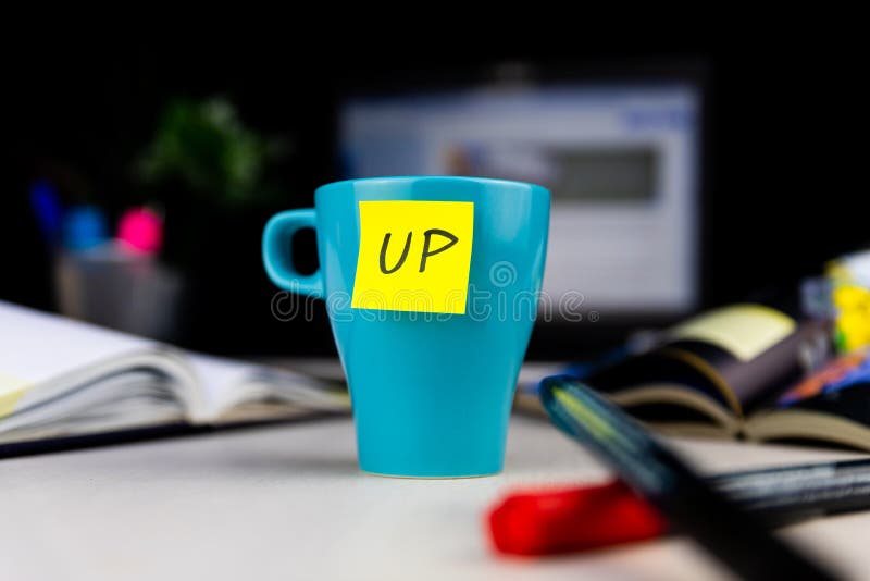 Sticky Note on a Coffe Cup at Office Desk. Wake Up Stock Image - Image ...