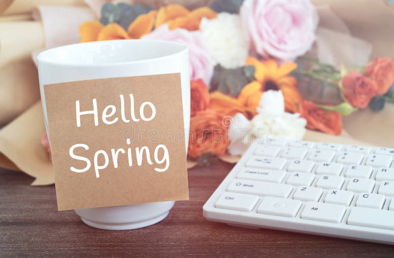 Sticky Note on a Cup of Coffee with Text Hello Spring Stock Image ...