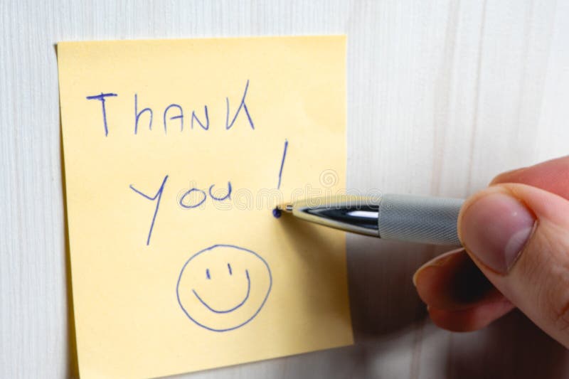 A Sticky Note Hanging on the Wall, with the Text Thank You on it Stock ...