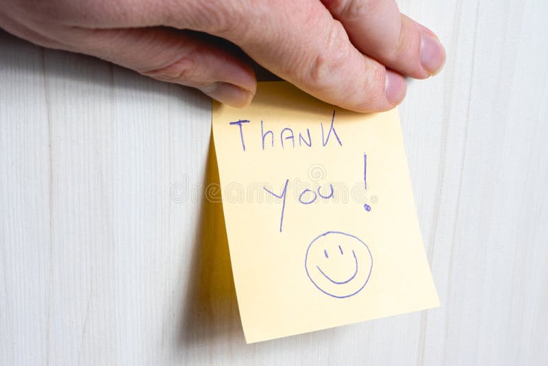 A Sticky Note Hanging on the Wall, with the Text Thank You on it Stock ...