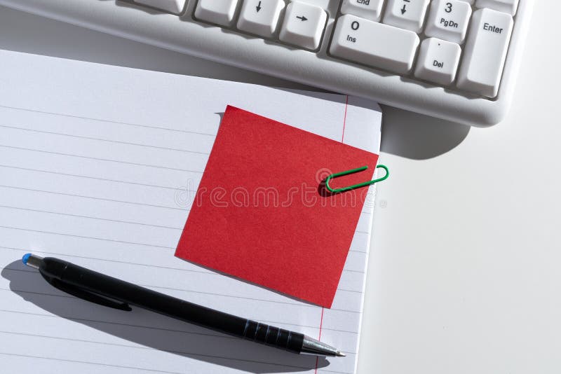 Sticky Note with Important Idea Clipped on Opened Notebook on Desk with ...