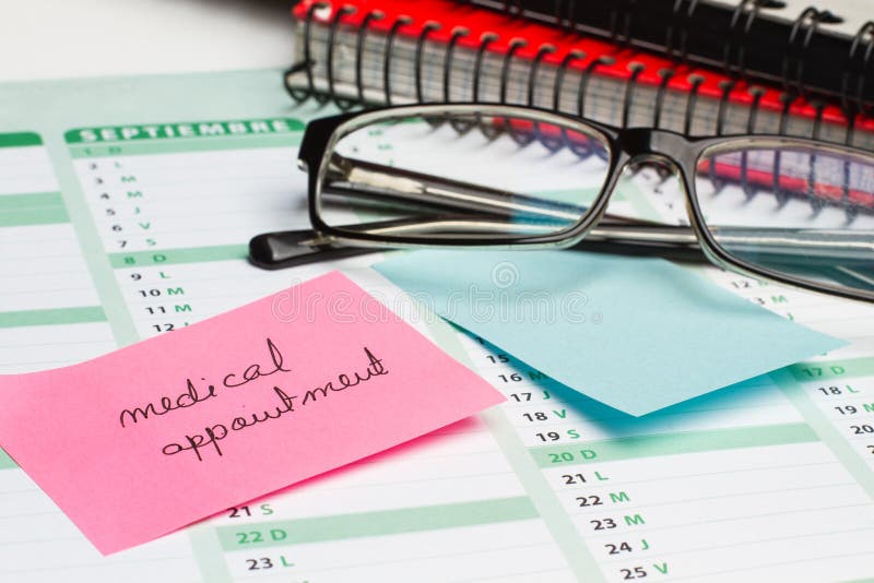 Sticky Note and Eyeglasses on a Calendar Stock Image - Image of ...