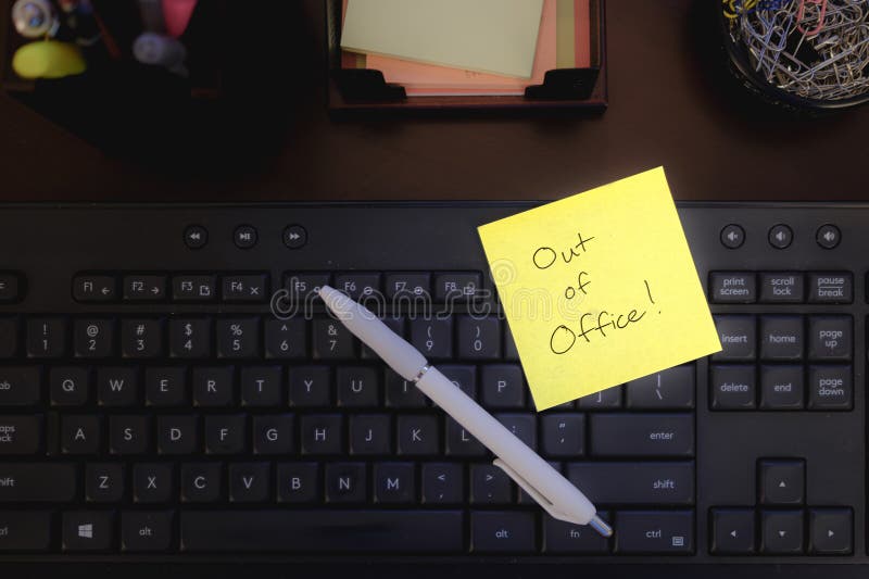 Sticky Note on Office Desk Saying "Out of Office" Stock Image - Image ...