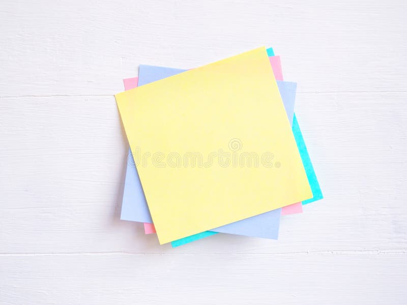 Sticky Note ( Post-it) Stack on a White Wooden. Stock Photo - Image of ...