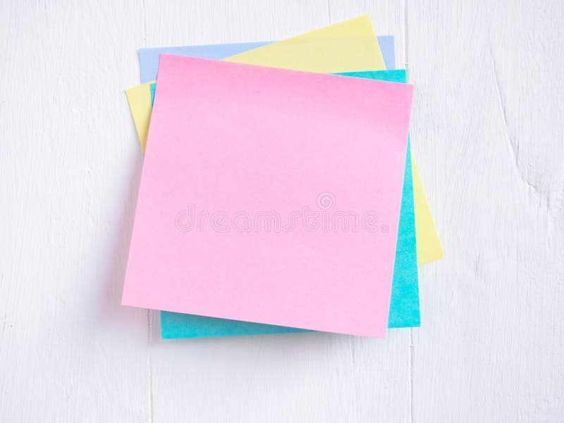 Sticky Note Post-it Stack on a White Wooden. Stock Photo - Image of ...