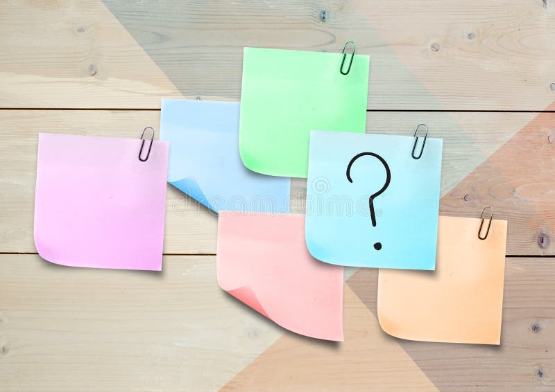 Sticky Note with Question Icon Against a Wood Wall Stock Photo - Image ...