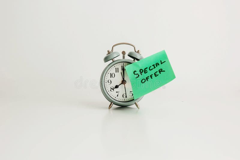 Sticky Note with SPECIAL OFFER Attached To an Alarm Clock Stock Image ...