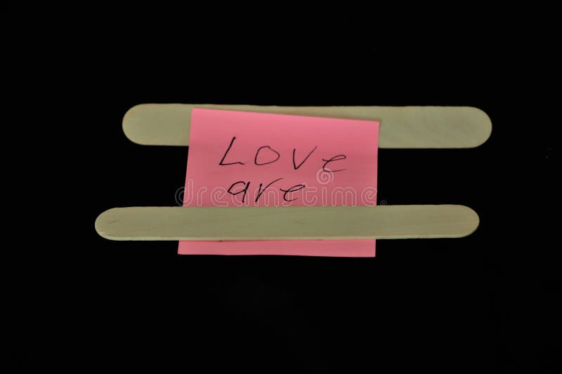 Sticky Note with Text Love on it. Stock Image - Image of back, blac ...