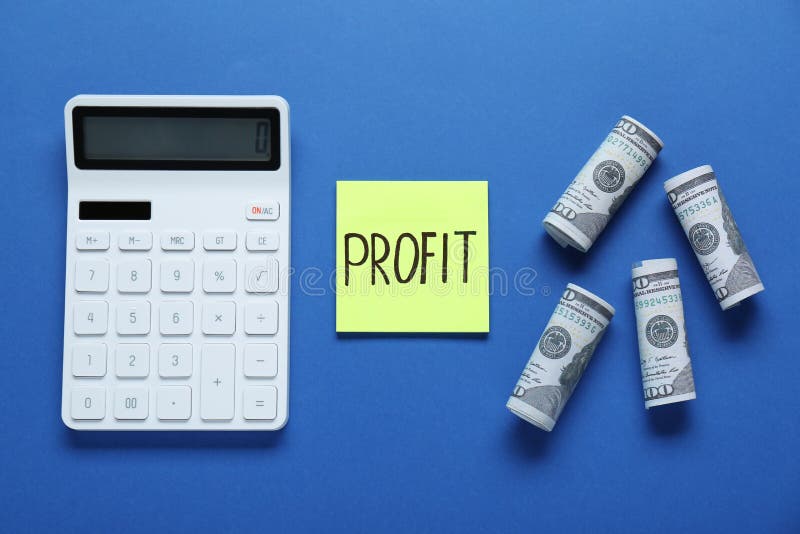 Sticky Note with Word Profit, Rolled Banknotes and Calculator on Blue ...