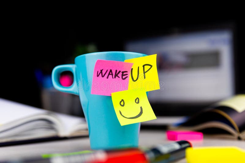 Sticky Notes on a Coffe Cup at Office Desk. Wake Up and Smile. Begin ...