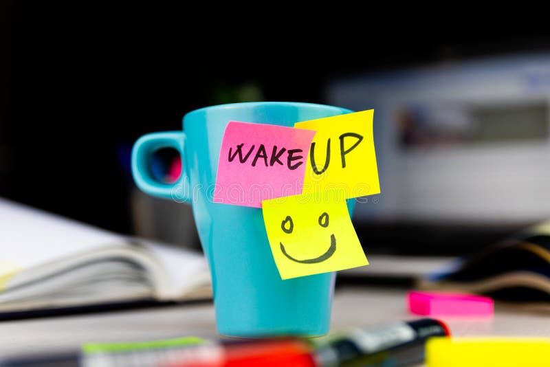 Sticky Notes on a Coffe Cup at Office Desk. Wake Up and Smile. Begin ...