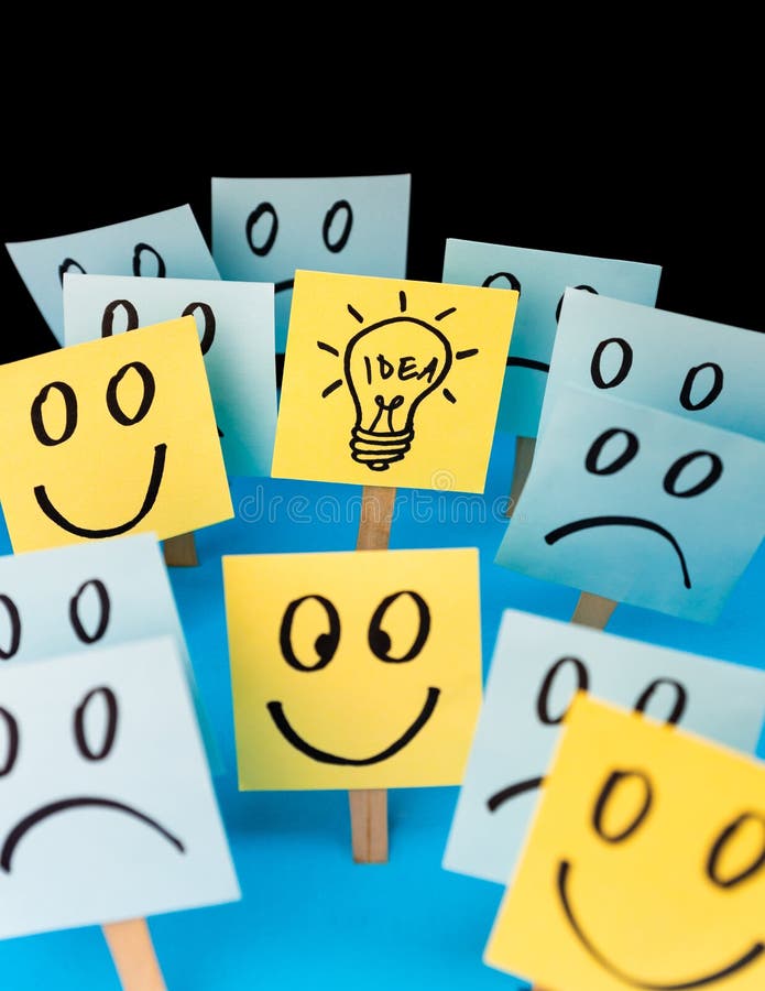 Sticky Notes with Hand Drawn Lightbulb, Smiley and Sad Faces. Focus on ...