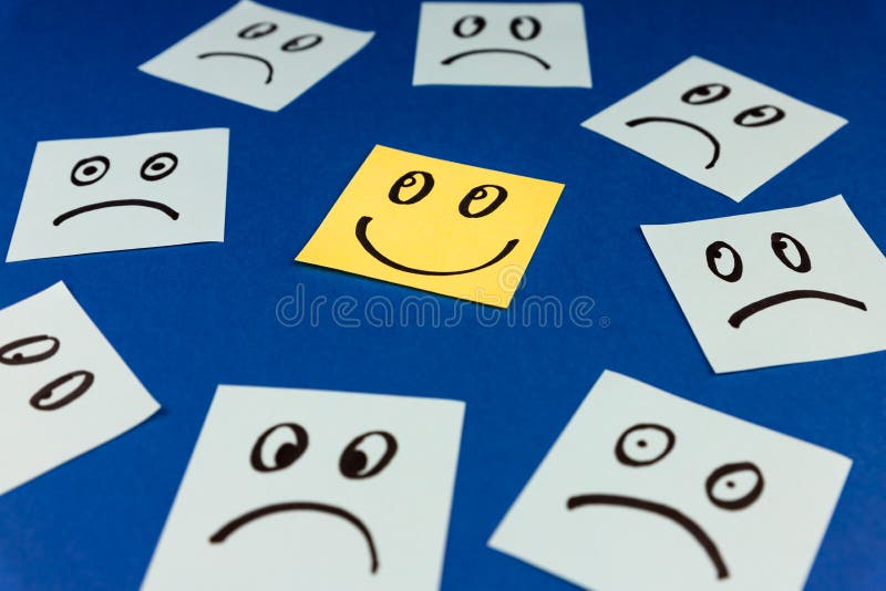 Sticky Notes with Hand Drawn Smiley Face and Sad Faces on Blue ...