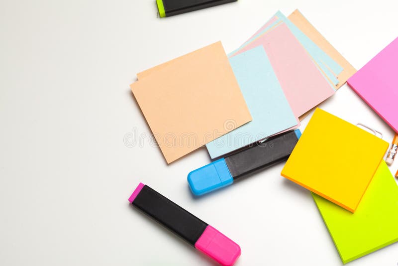 Sticky Notes with Markers, Colored Pens, Paper Clips Laying on a Table ...