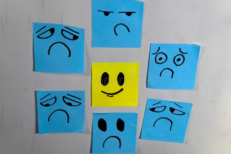 Sticky Notes with Sad Faces Surround a Single Yellow Note with a Smiley ...