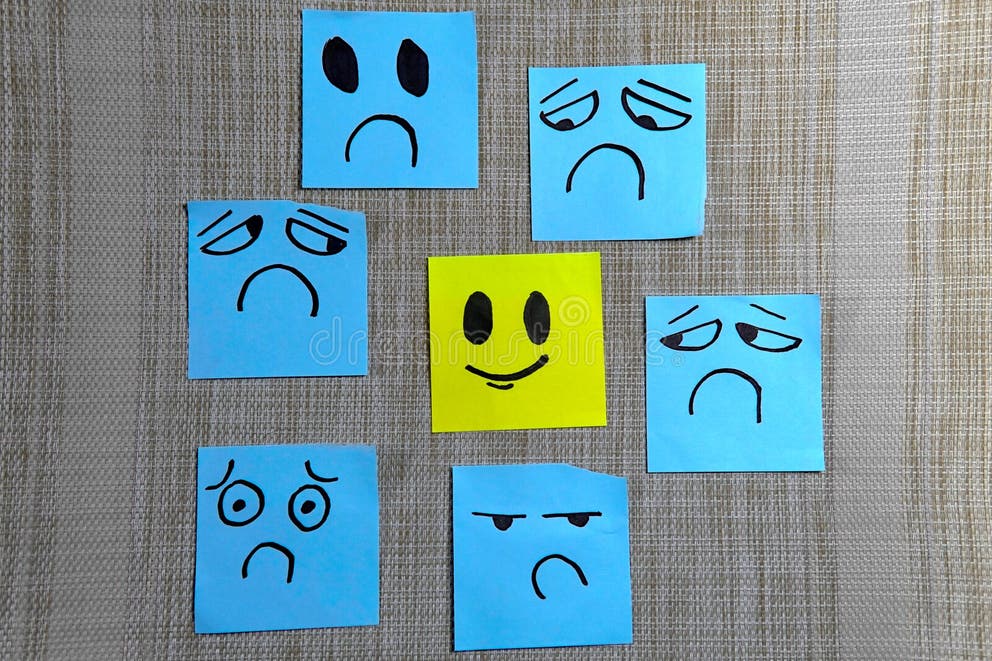Sticky Notes with Sad Faces Surround Two Yellow Notes with Smiley Faces ...