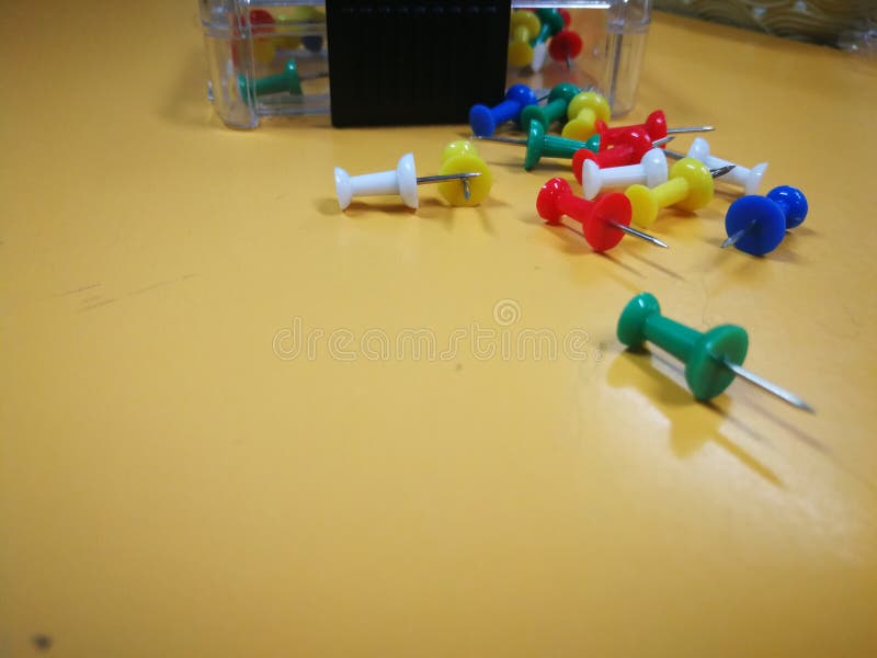 Sticky Pins of Many Colors, Placed in Groups on the Yellow Paper Sorter ...