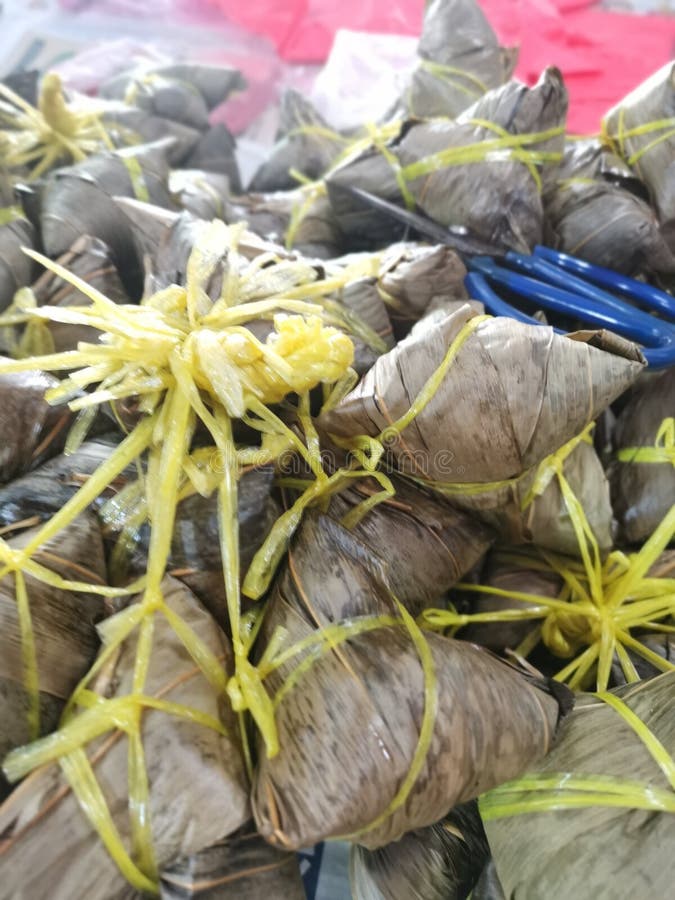 Sticky Rice with Meat Filling Wrapped with Bamboo Leaf Dumplings. Stock ...