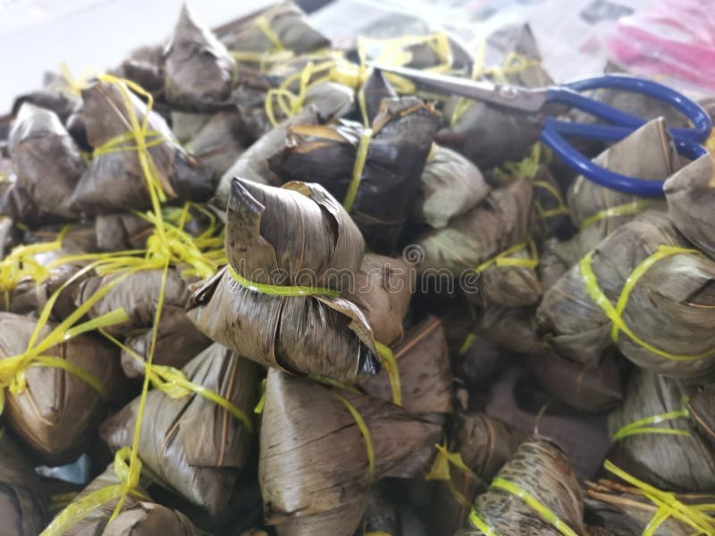 Sticky Rice with Meat Filling Wrapped with Bamboo Leaf Dumplings. Stock ...