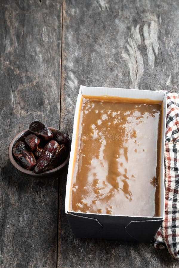 Sticky Toffee Pudding Butter Sponge with Dates on Wooden Table Stock ...