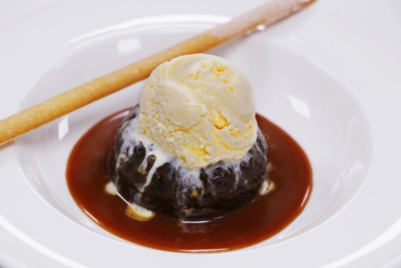 Sticky Toffee Pudding with Vanilla Ice Cream and Caramel Sauce Stock ...