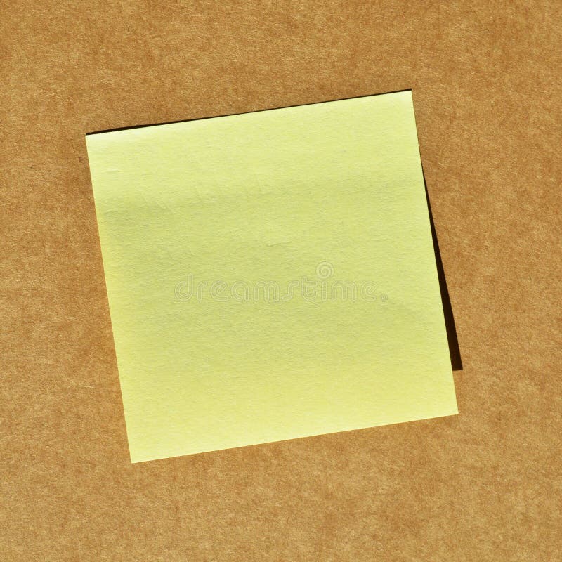 Sticky Yellow Note Paper on Beige and Brown Cardboard Paper Stock Image ...