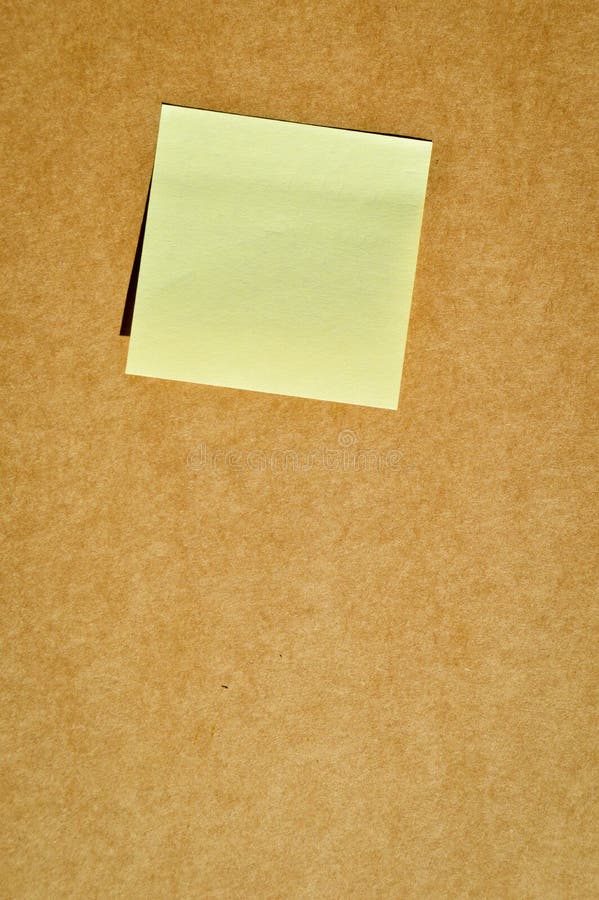 Sticky Yellow Note Paper on Beige and Brown Cardboard Paper Stock Photo ...