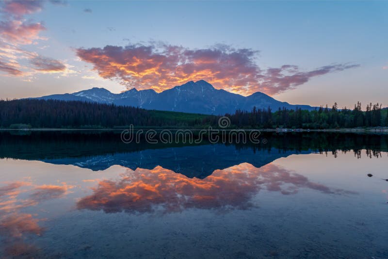 Still Lake and Mountain at Sunset, with Red Clouds Stock Photo - Image ...