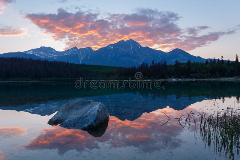 Still Lake and Mountain at Sunset, with Red Clouds Stock Image - Image ...