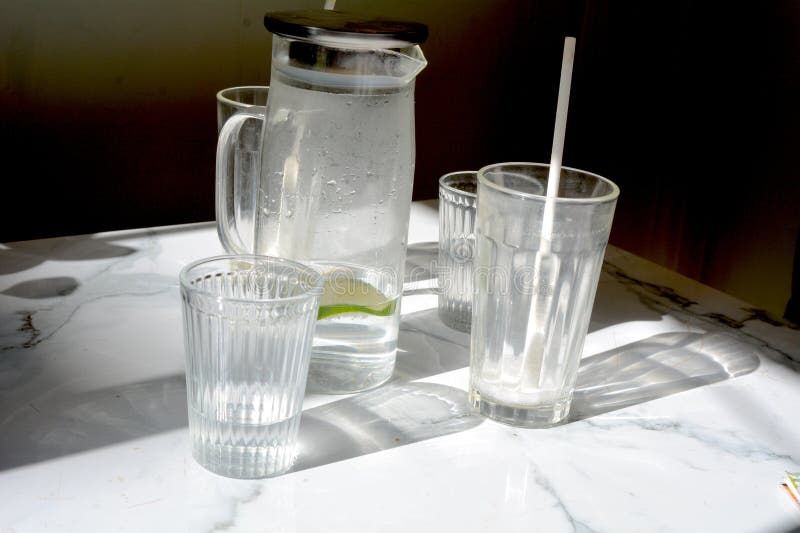 Still Life Cups and Plates on the Dining Table Under Light and Shadow ...