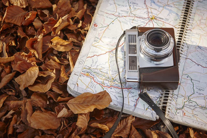 Still Life in the Autumn Forest with Camera and Map Stock Image - Image ...