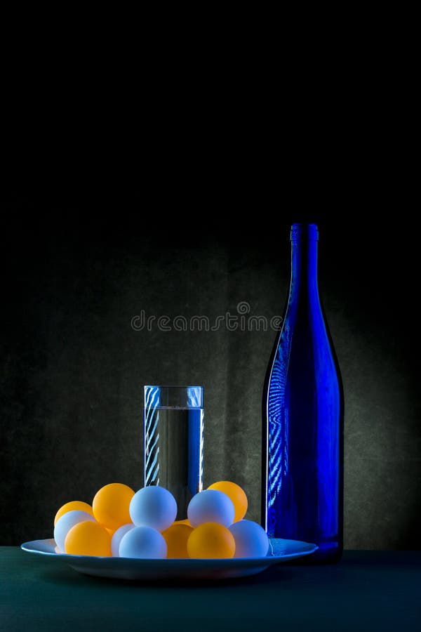 Still Life with Blue Bottle and Balls Stock Photo - Image of dark, life ...