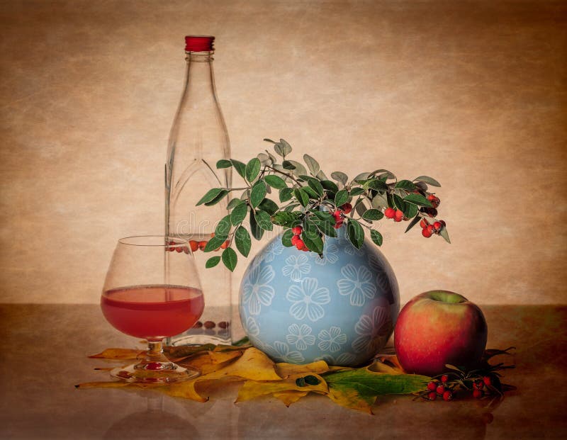 Still Life with Bottle, Glass, and Greenery Stock Photo - Image of ...